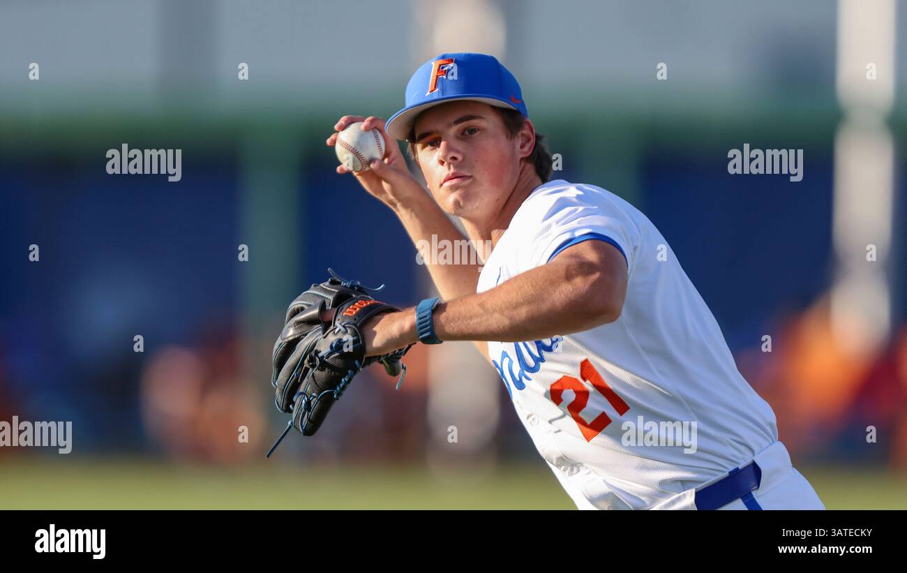 Florida utility Caden McDonald (21) warms up before an NCAA baseball ...