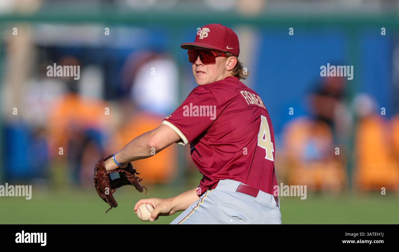 Florida State infielder Cal Fisher (4) warms up before an NCAA baseball ...