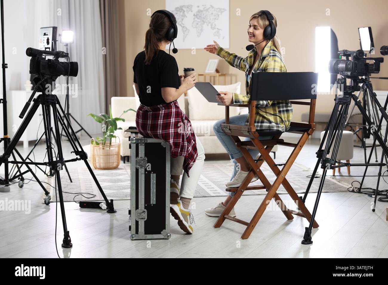 Young women working in modern film studio Stock Photo - Alamy