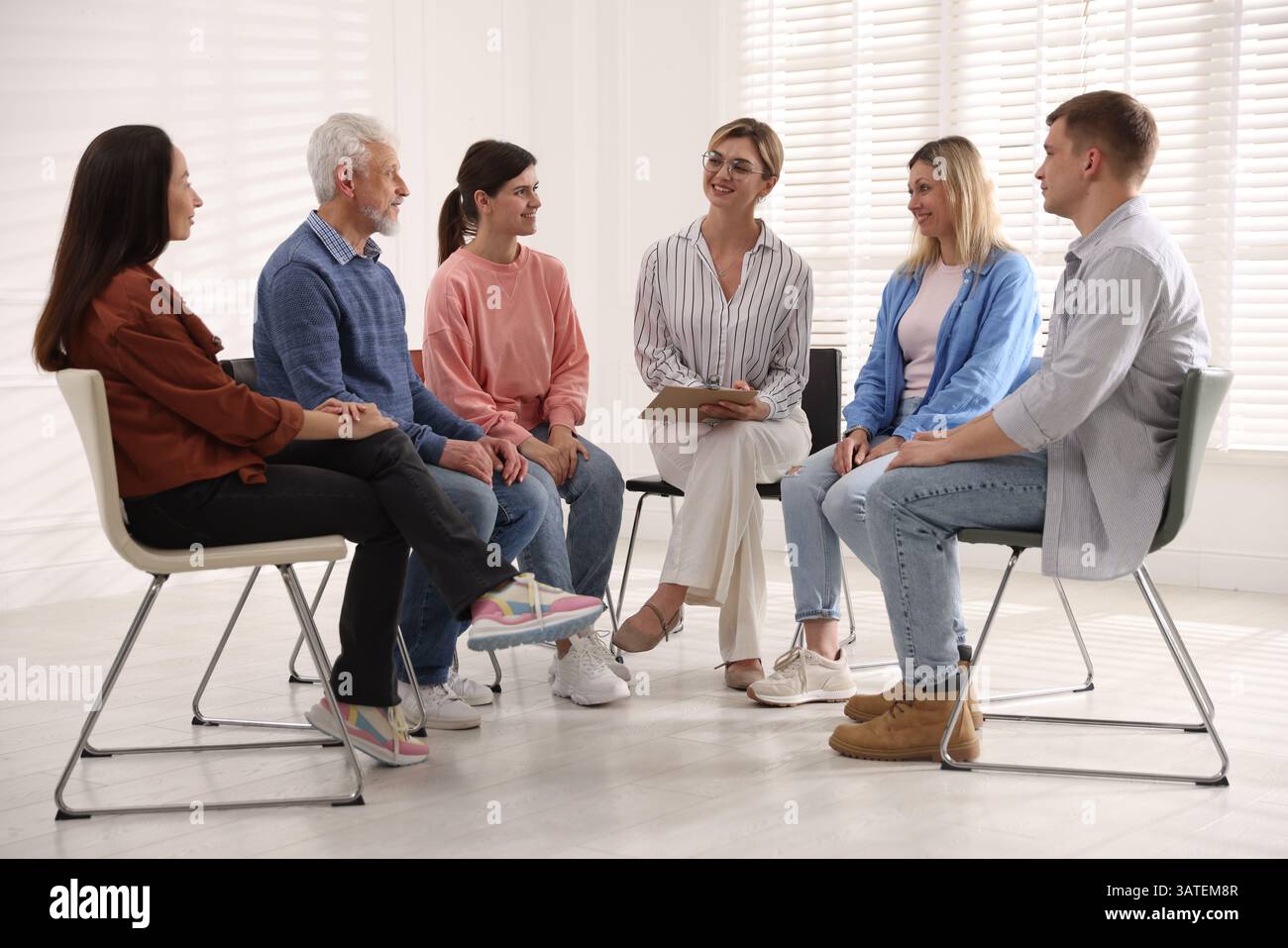 Group of people having psychotherapy session indoors Stock Photo - Alamy