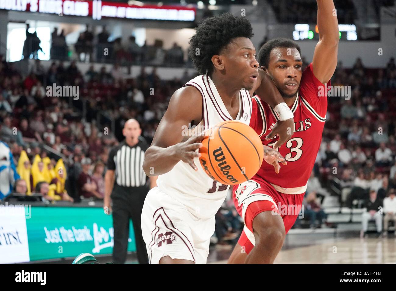 FILE - Mississippi State guard Trey Fort (11) uses his elbow to dribble ...
