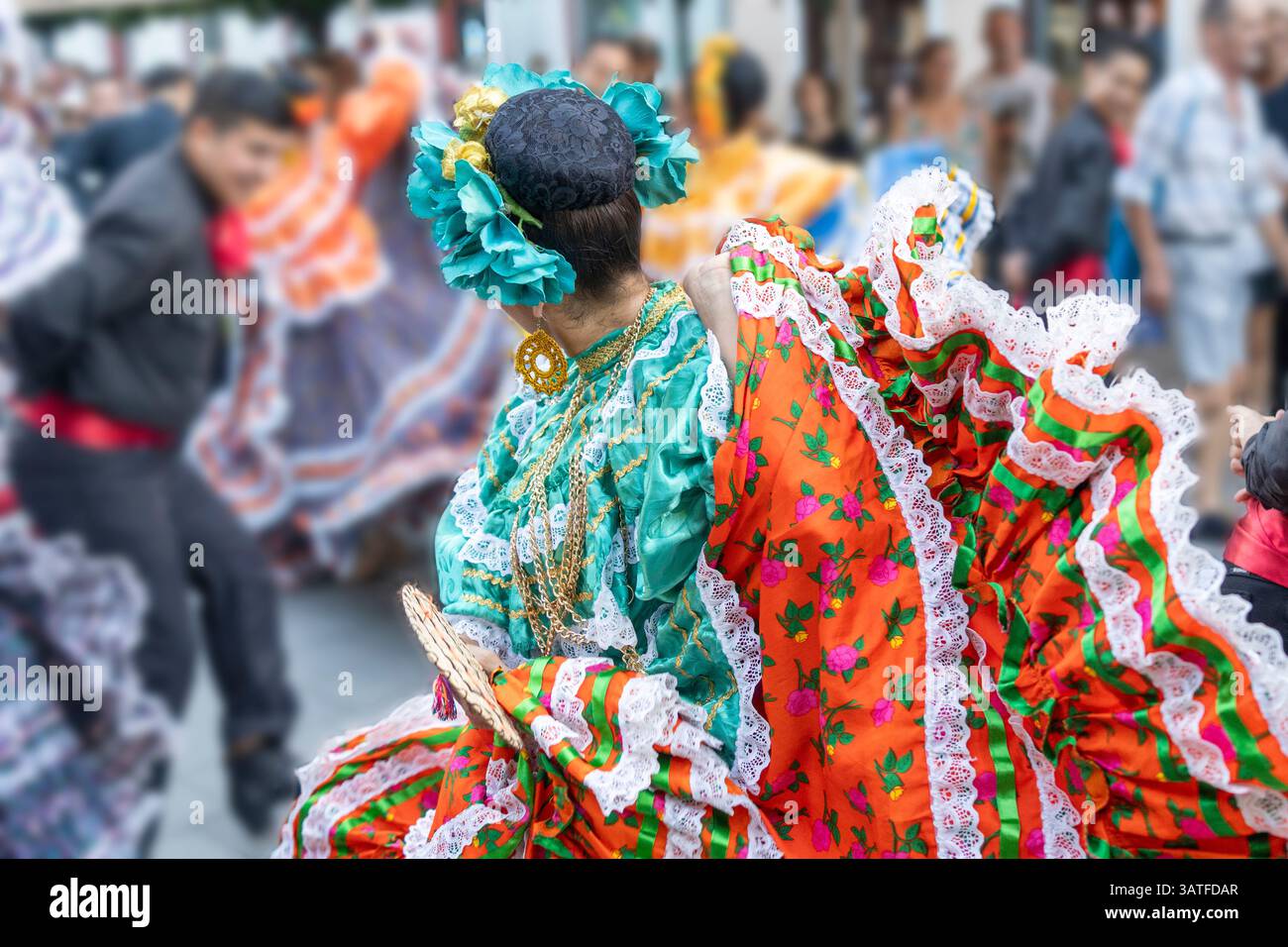 Colorful clothes of traditional Mexican folklore dancers in motion ...