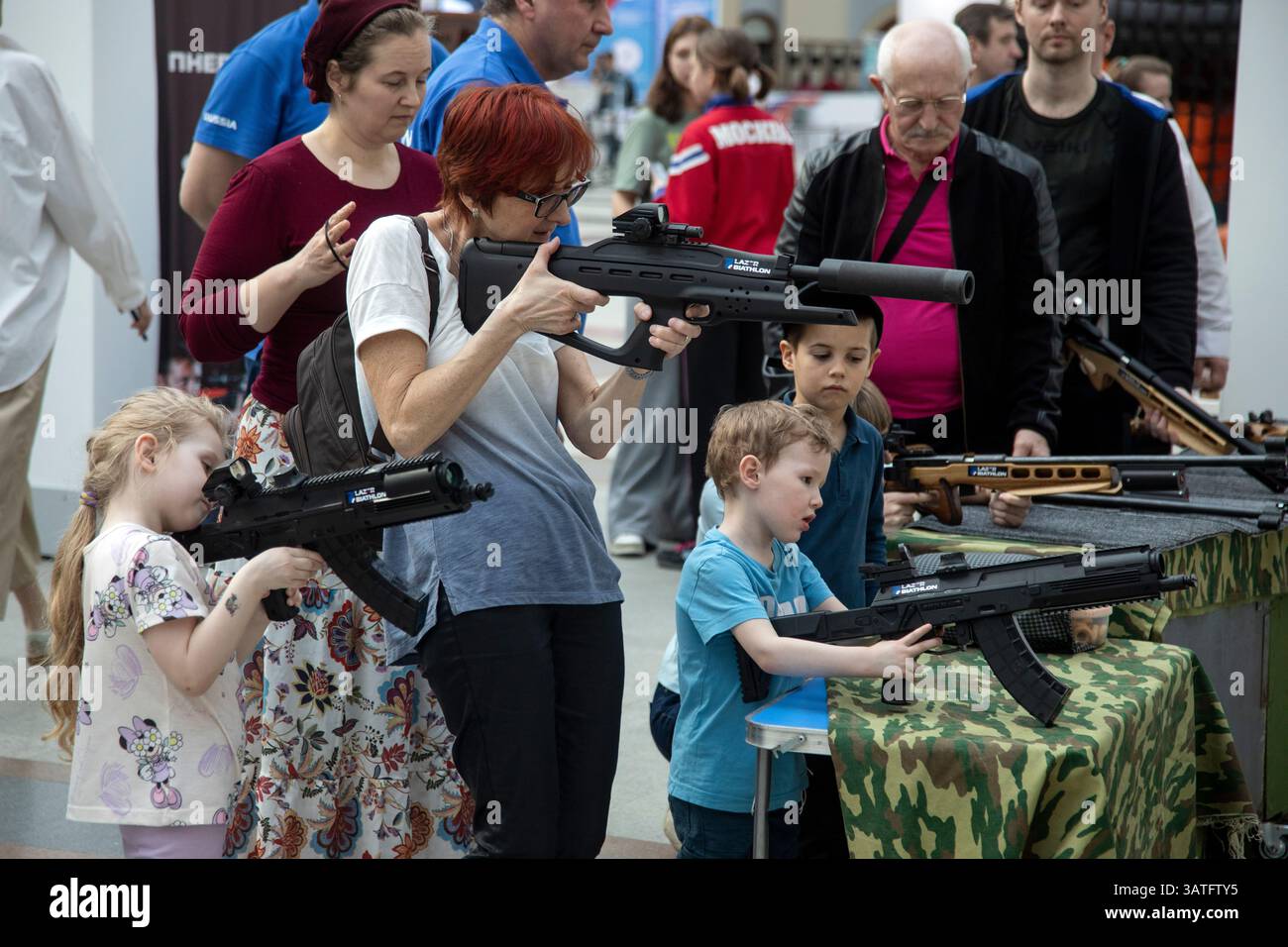 Moscow, Russia. 18th of April, 2025. Visitors learn how to shoot rifles ...