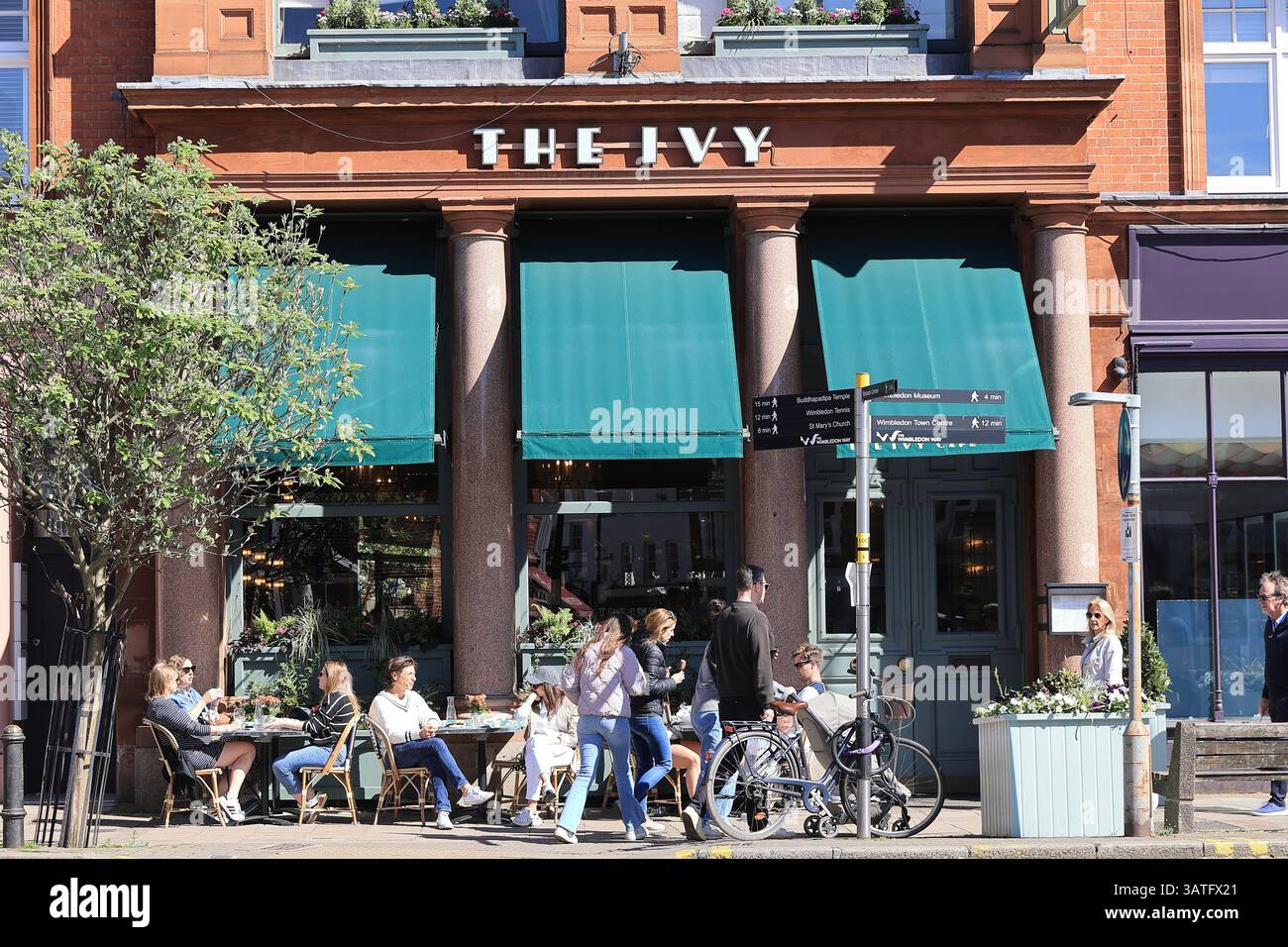 Upmarket restaurant The Ivy Cafe in Wimbledon village, with diners ...
