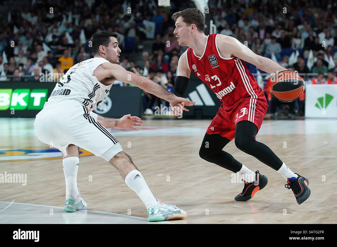 Madrid, Spain. 18th Apr, 2025. Real Madrid's Alberto Abalde (l) and FC bayern Munich's Andreas ...
