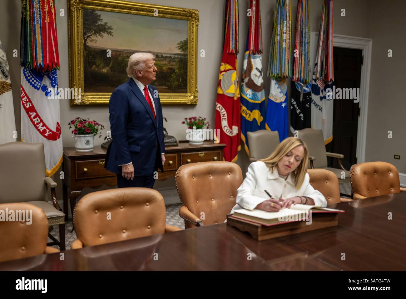 Prime Minister Giorgia Meloni of Italy signs the guest book in the ...