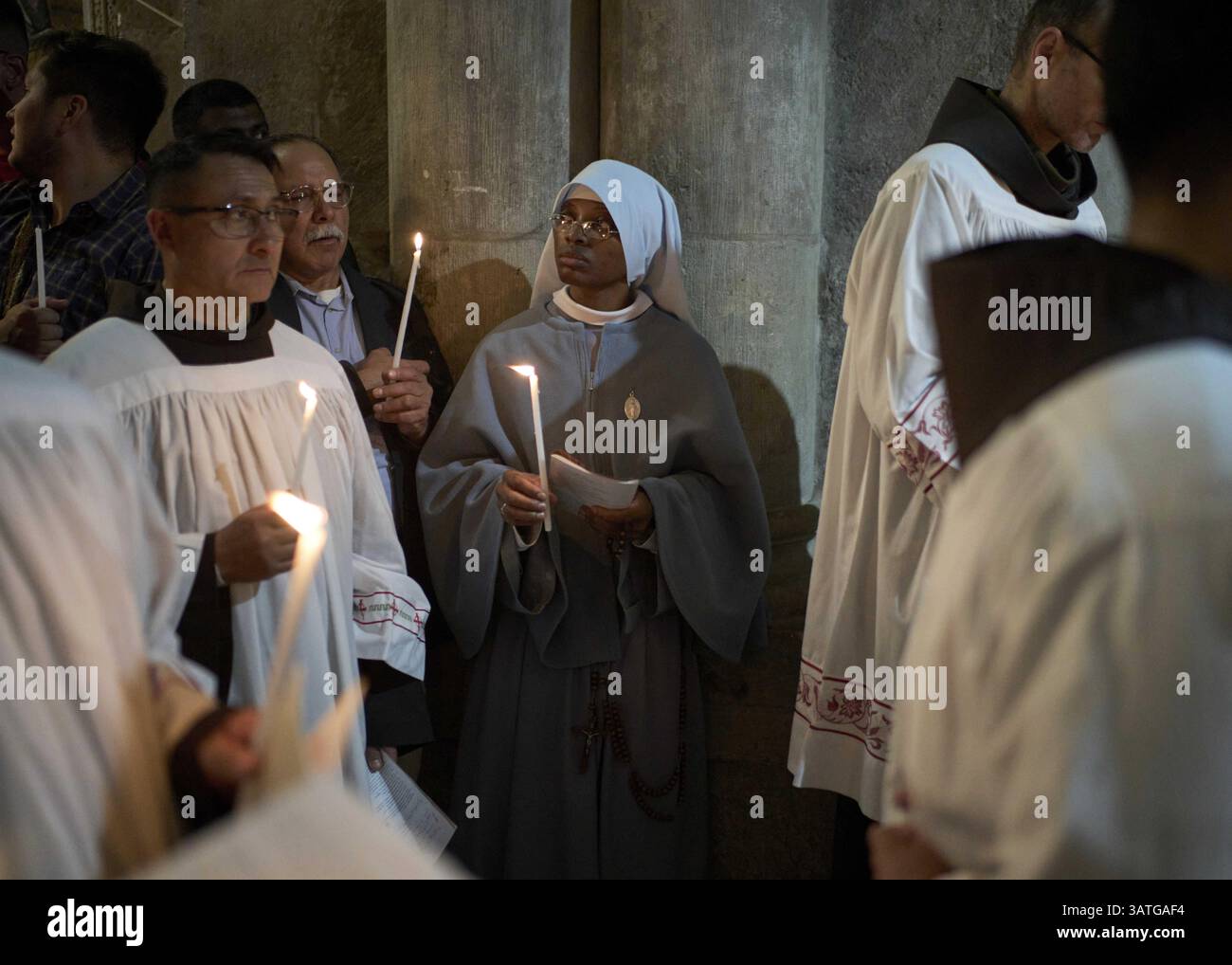 A Catholic nun attends a Good Friday ceremony reenacting the funeral of ...