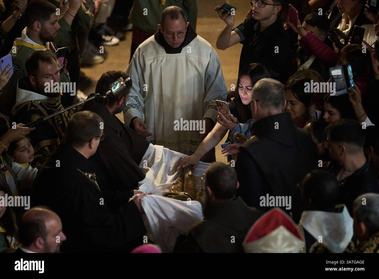 Catholic clergymen take part in a Good Friday ceremony reenacting the ...