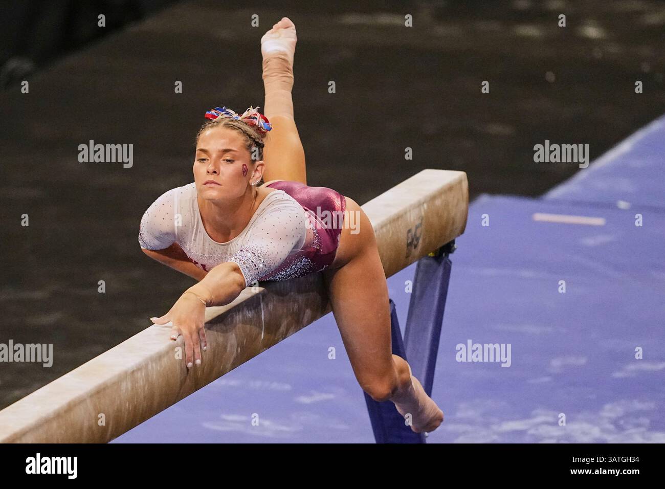 Oklahoma's Jordan Bowers competes on the balance beam during the NCAA ...
