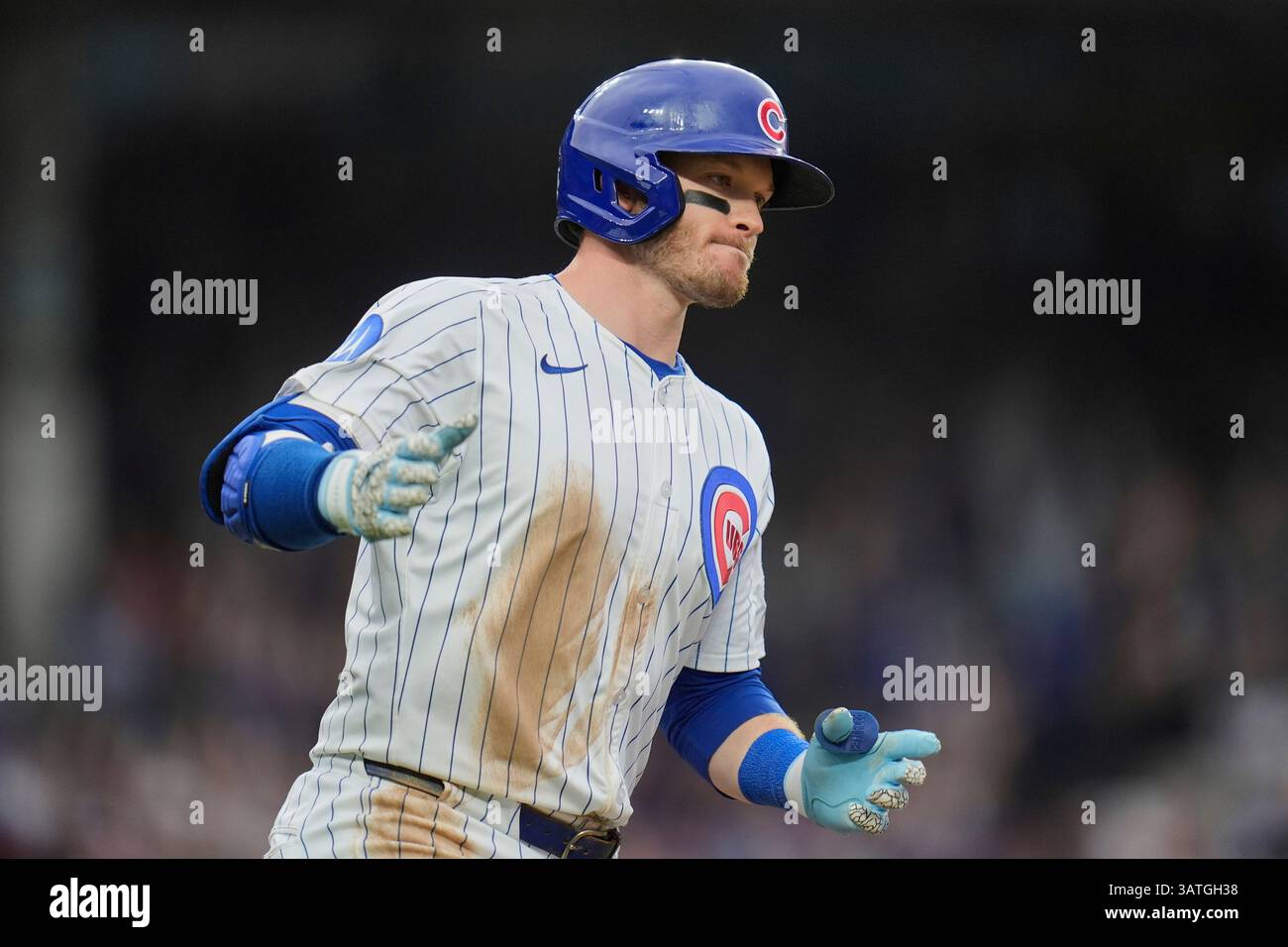 Chicago Cubs' Ian Happ runs the bases after hitting a grand slam during ...