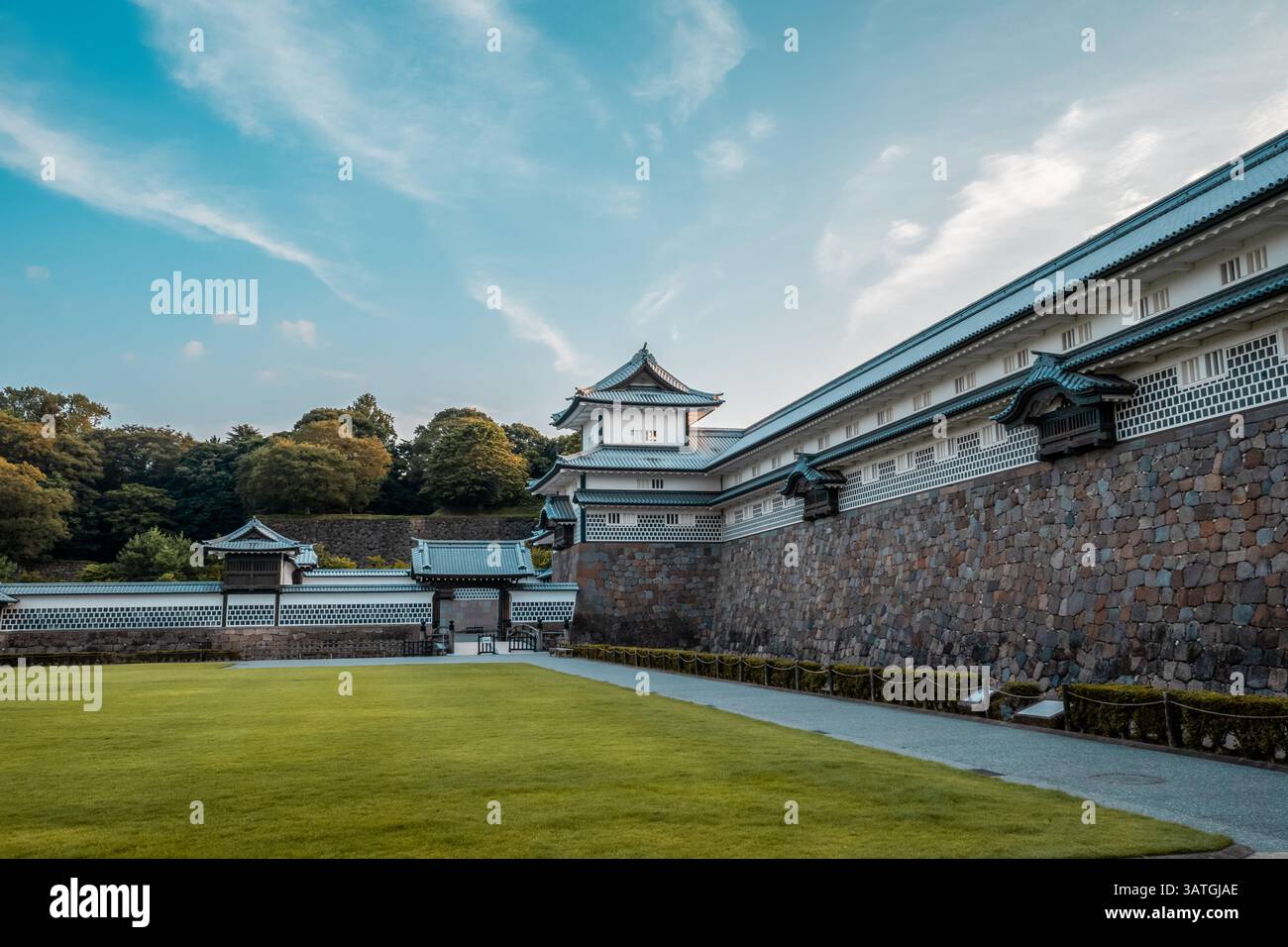 Serene view of a traditional Japanese castle wall with tiled roofs ...
