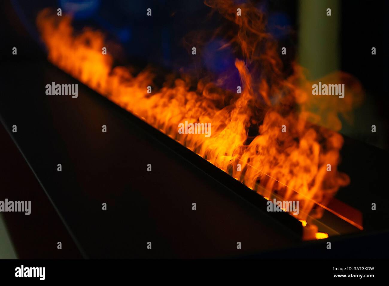 Bright fire burns in a fireplace. Homeliness Stock Photo - Alamy