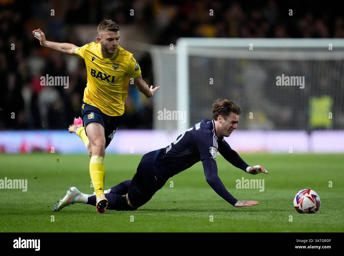 Leeds United's Joe Rodon (right) is fouled by Oxford United's Stanley ...