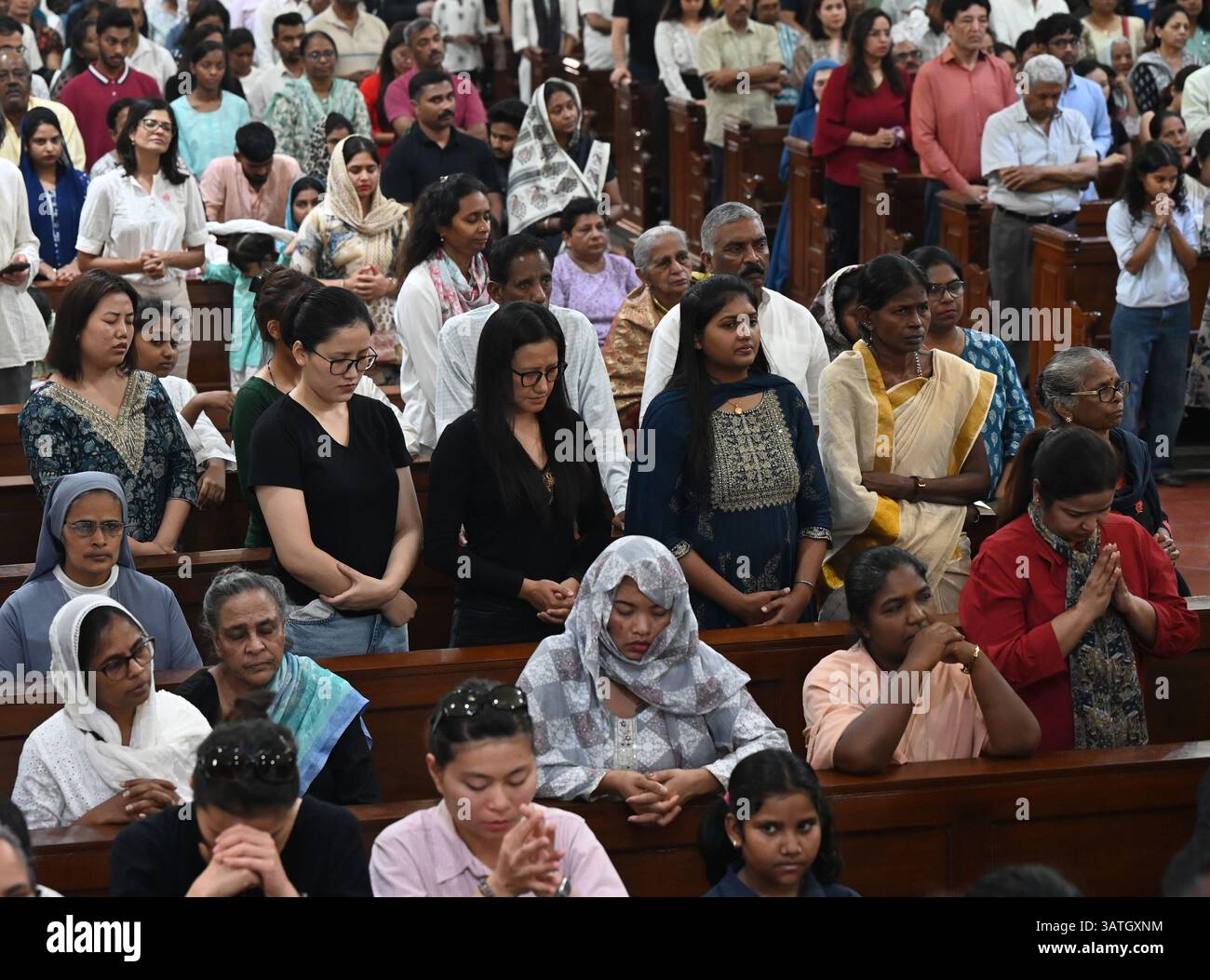 NEW DELHI, INDIA - APRIL 18: Christians people attend a mass prayer to ...