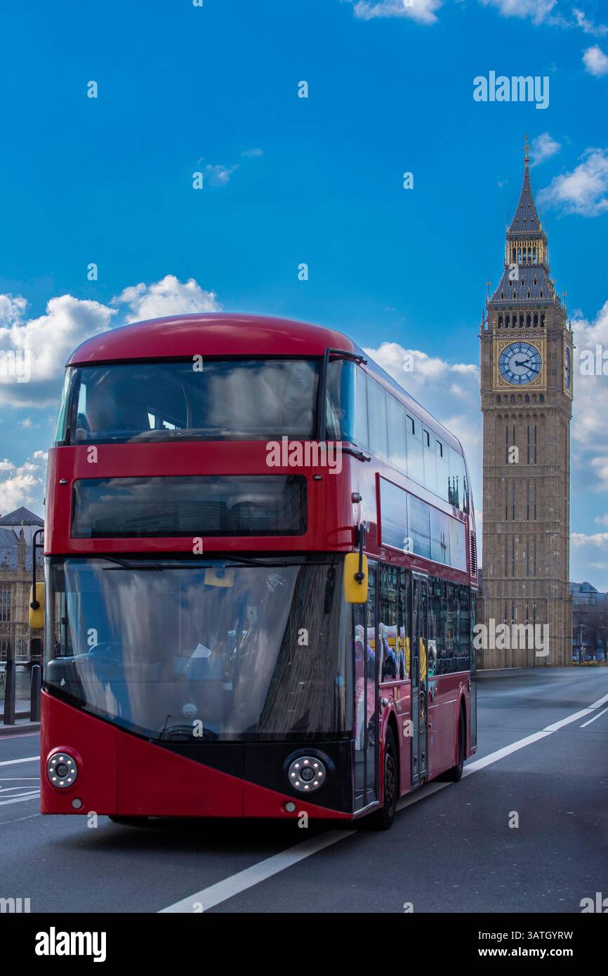 Iconic red double-decker bus passing by Big Ben under a blue sky in ...