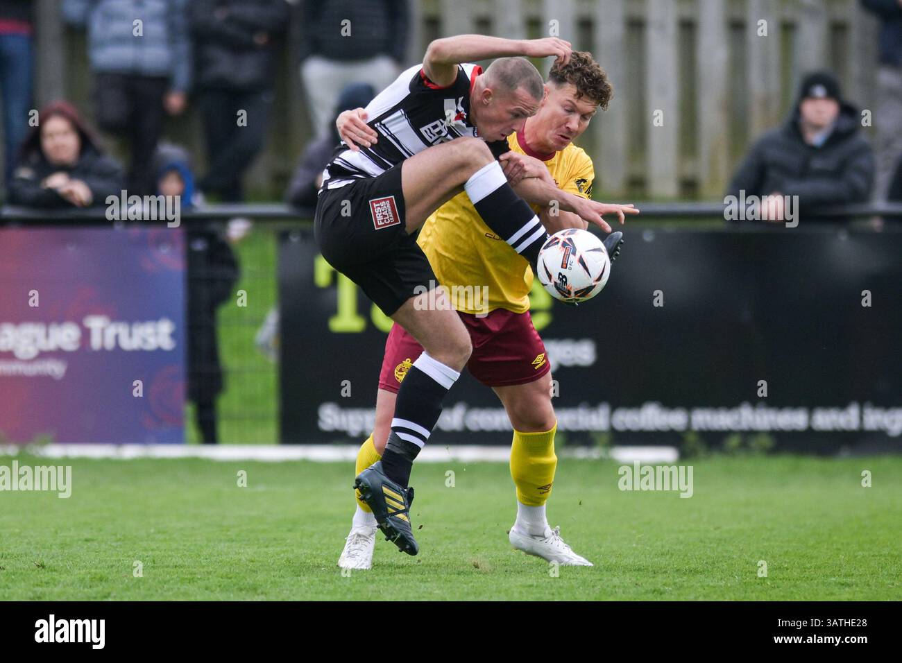 Darlington FC Jack Maskell hold the ball from Dillion Morse of South ...