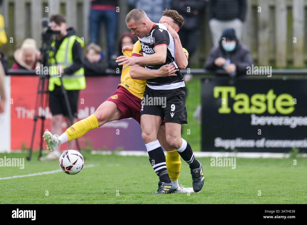 Darlington FC Jack Maskell hold the ball from Dillion Morse of South ...
