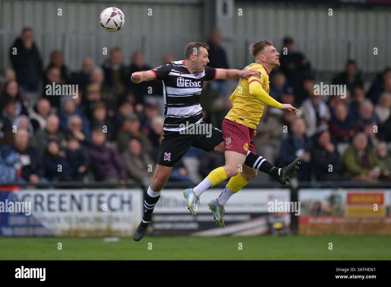 South Shields Mackenzie Heaney flicks the header on before Blair Adams ...