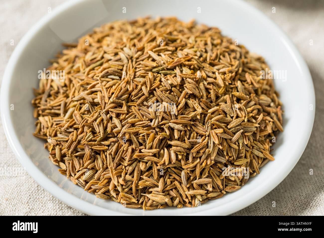 Organic Raw Dry Cumin Seeds in a Bowl Stock Photo - Alamy