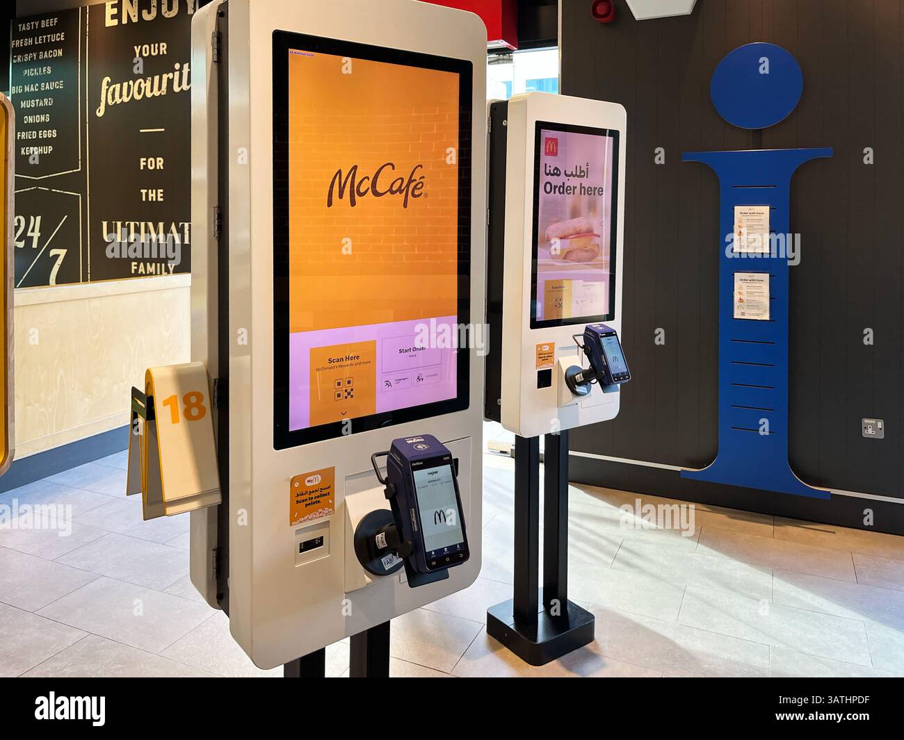 Self-service ordering kiosks in McDonald's restaurant payment terminals. Fast food restaurant ...