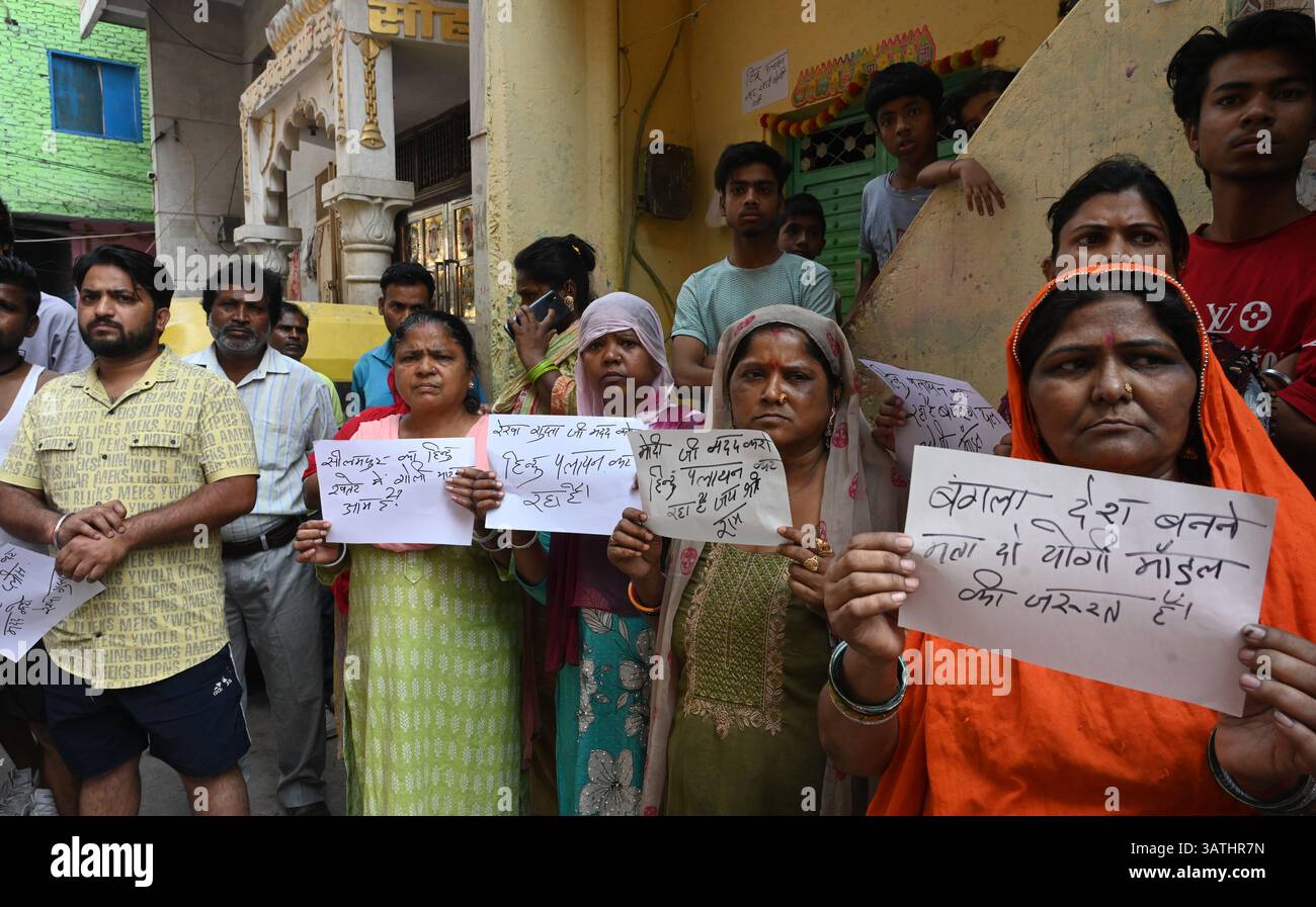 NEW DELHI, INDIA - APRIL 18: Local residents protesting hold pla cards ...
