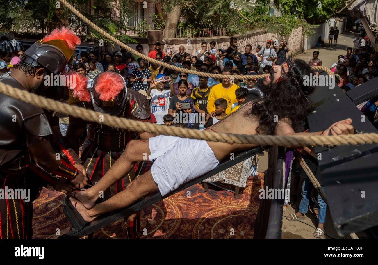 MUMBAI, INDIA - APRIL 18: People reenact the crucifixion of Jesus ...