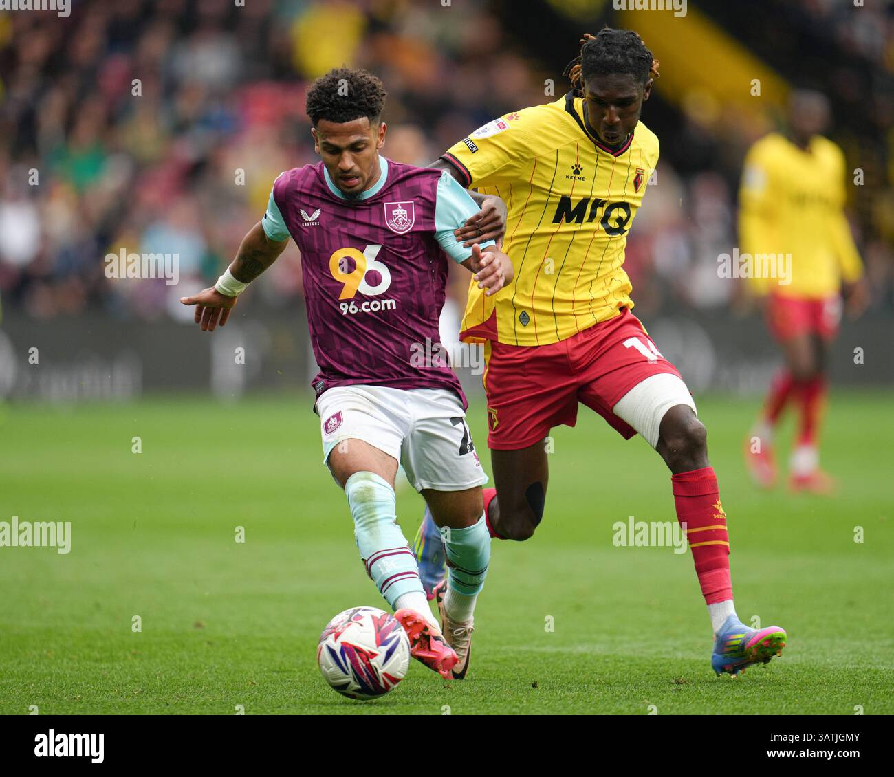 Marcus Edwards of Burnley holds off Pierre Dwomoh of Watford during the ...