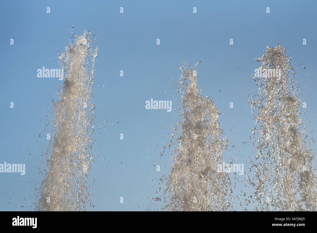 Abstract close-up of water splashing from a fountain with dynamic ...