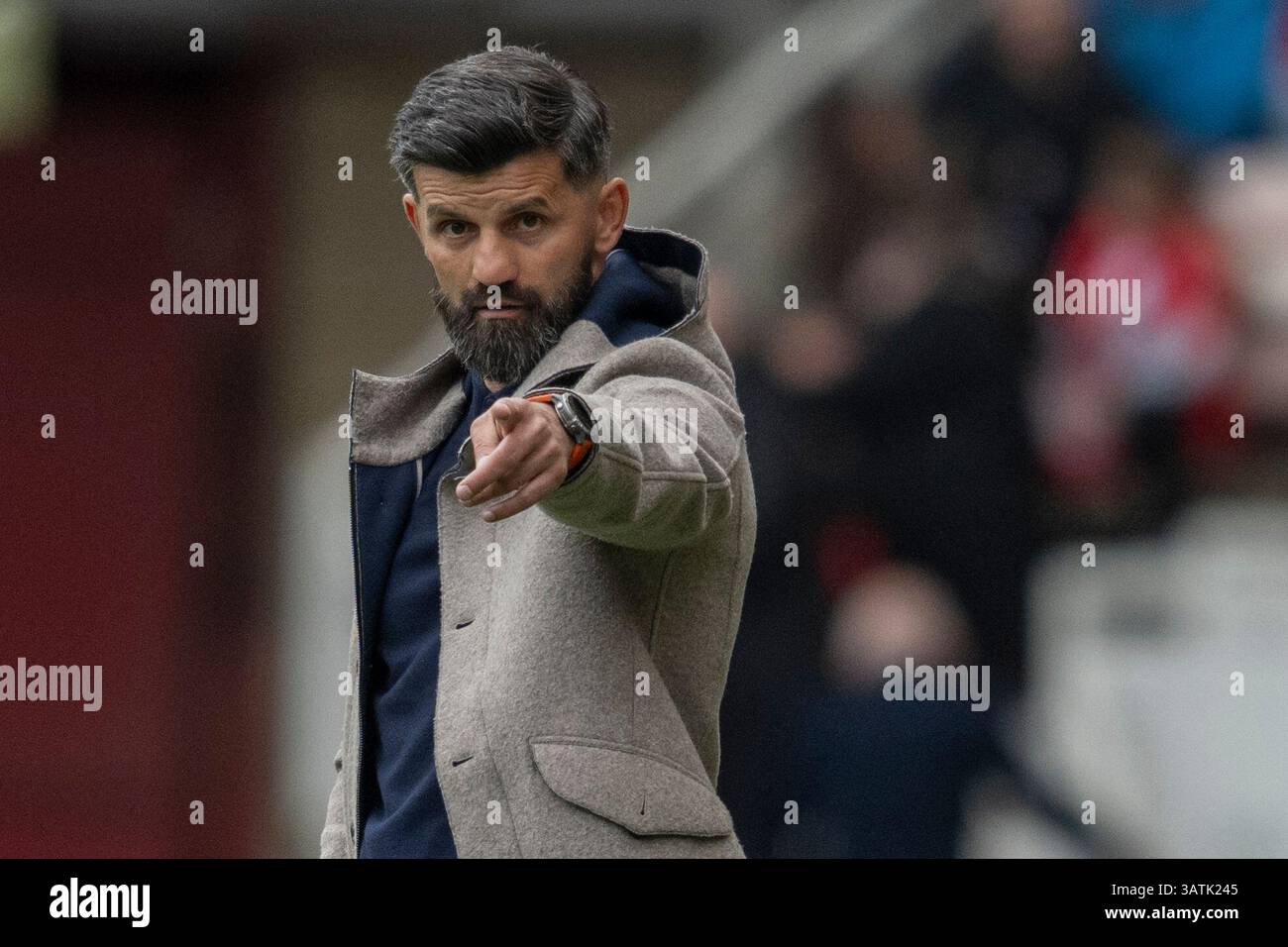 Plymouth Argyle Manager Miron Muslic waves instructions from the side ...