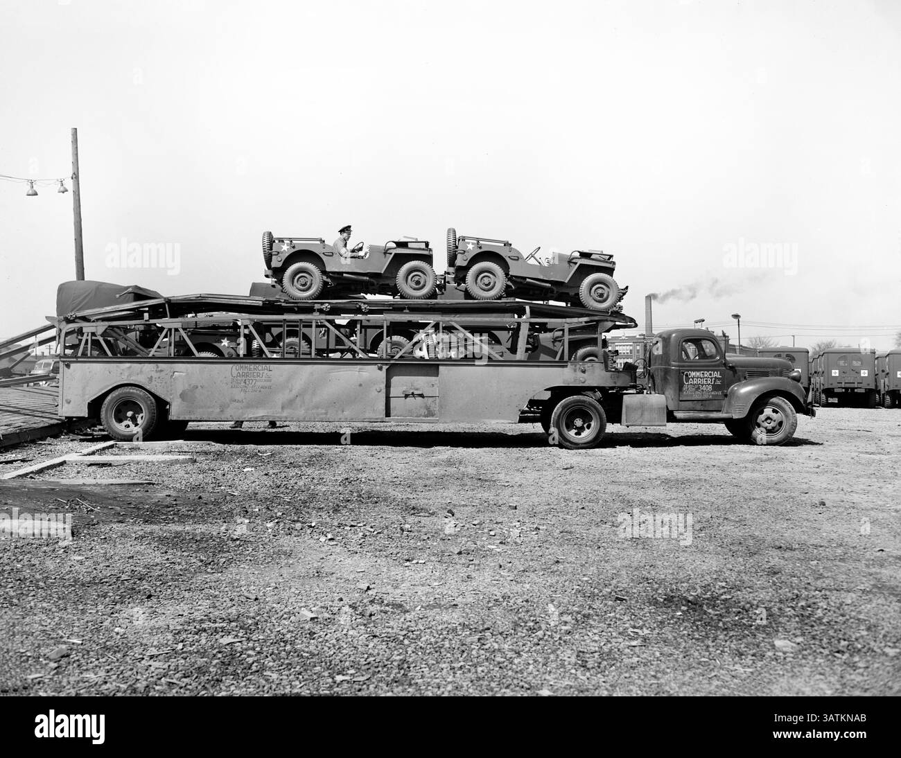 Haulaway loaded with U.S. Army vehicles, Detroit, Michigan, USA, Arthur ...