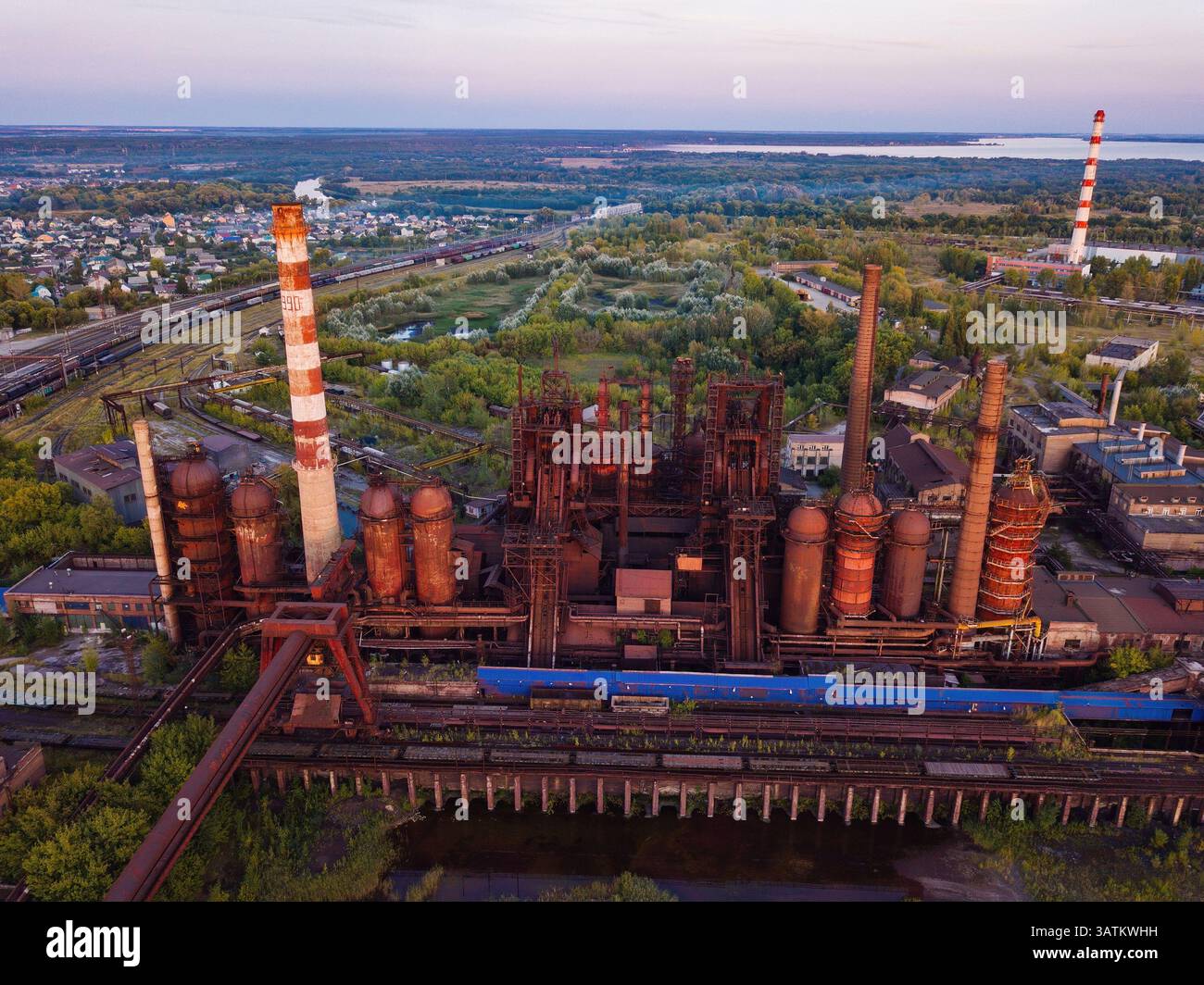 Blast furnace equipment of the metallurgical plant at the sunset ...