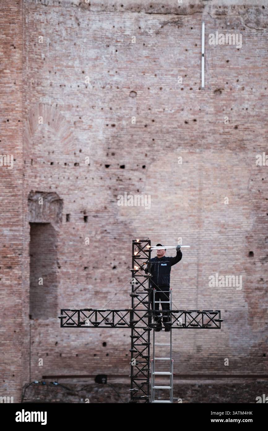 Rome, Via Crucis. Lighting the cross with fire. On Good Friday before ...