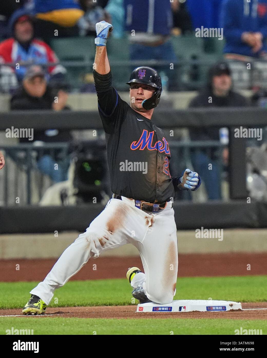 New York Mets' Pete Alonso celebrates after hitting a triple during the ...