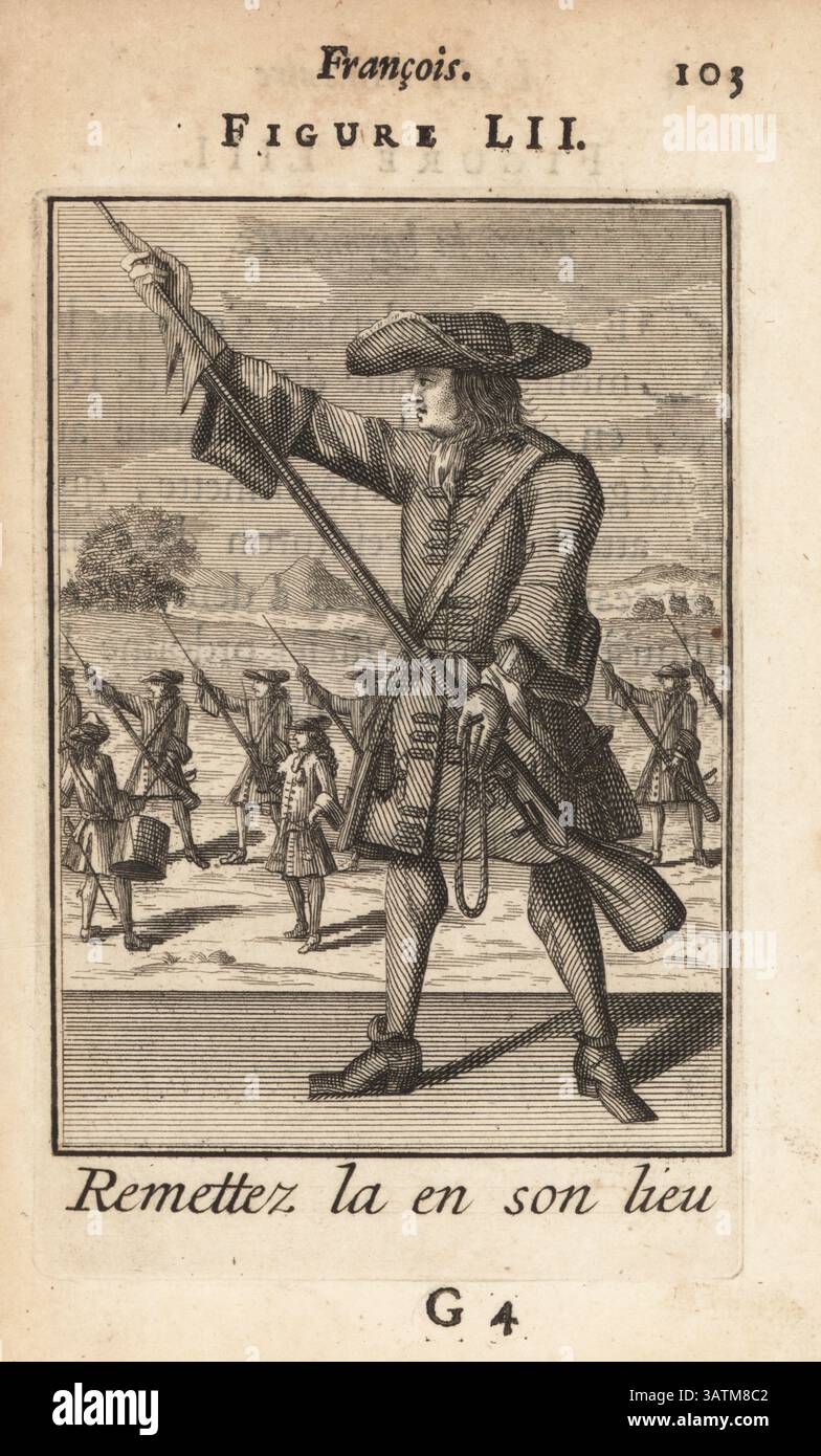 French soldier returning the ramrod to its place. Musketeer in tricorn ...