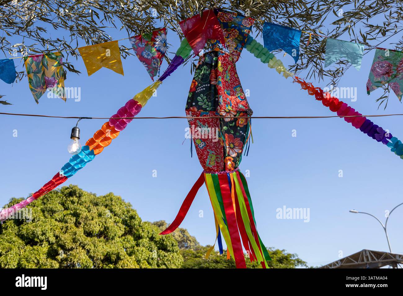 Balloons and hanging flags form a multicolored scene and decorate an ...