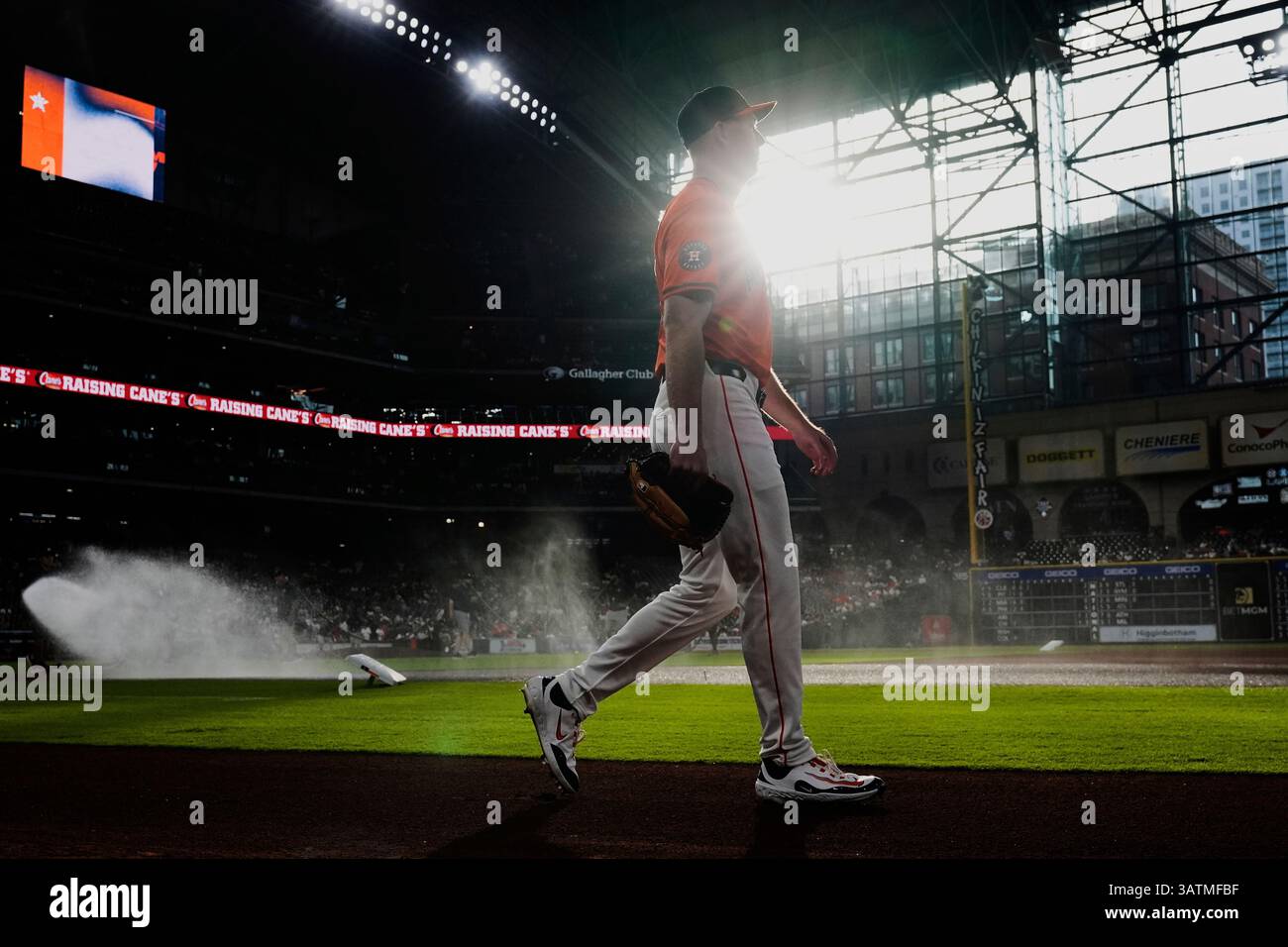 Houston Astros starting pitcher Ryan Gusto walks to the bullpen before ...
