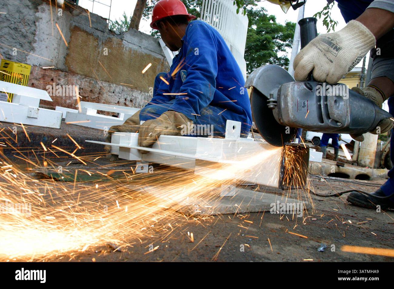 Sao Paulo, Brazil - circa dez 2002 - worker grinding steel in civil ...