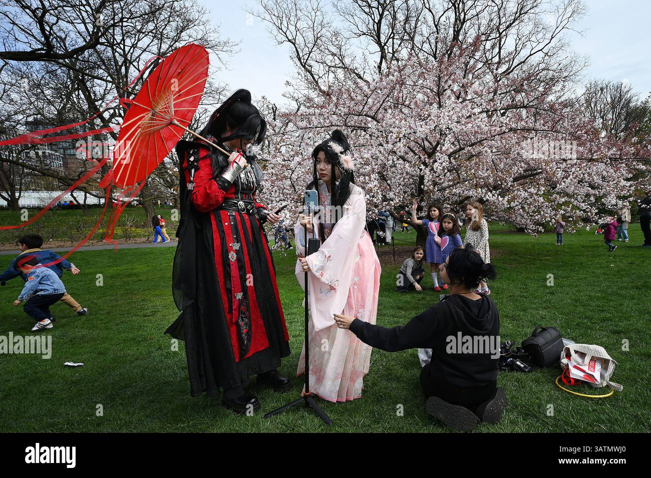 New York, USA. 18th Apr, 2025. Content creators make a video while ...