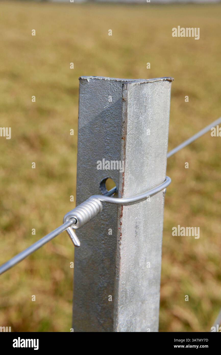 detail of construction of new steel fence in farm on countryside in ...