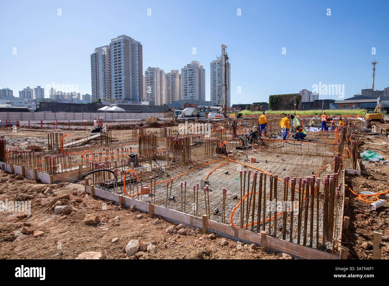 Construction workers during installation of steel gratings for the ...