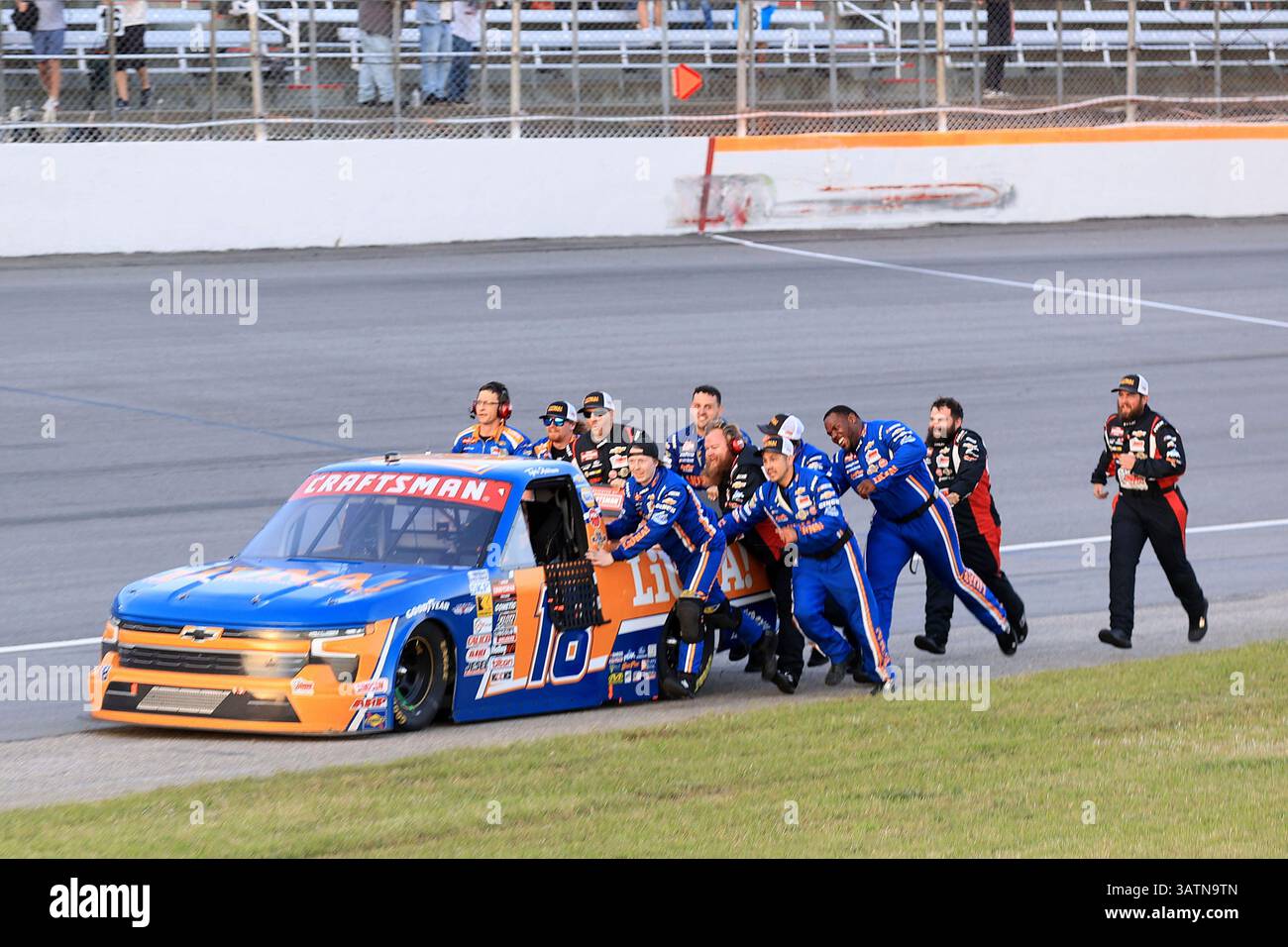 ROCKINGHAM, NC - APRIL 18: The #18 teams pushes Tyler Ankrum (#18 ...