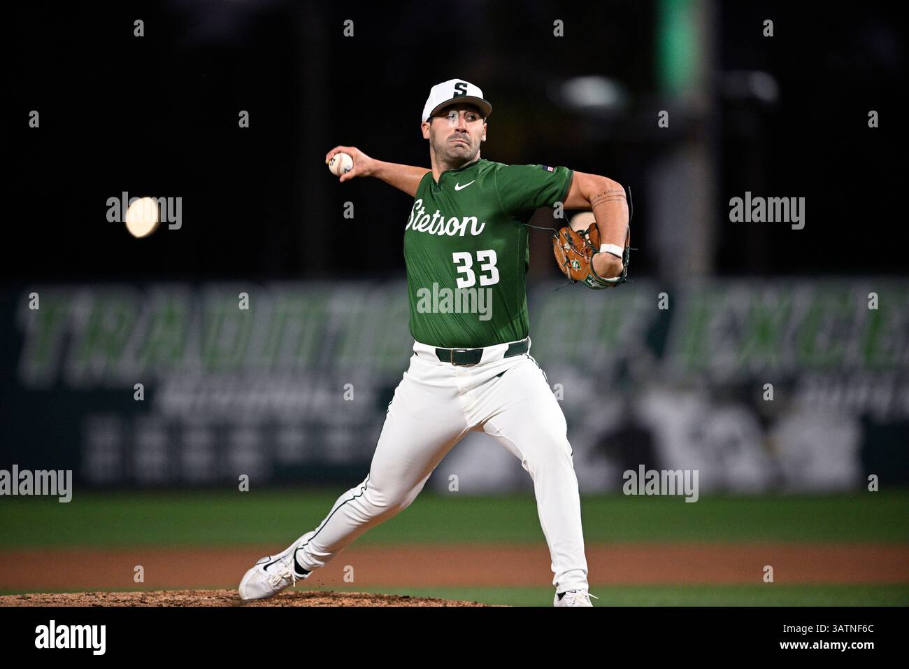 Stetson pitcher Justin Solimine (33) throws during an NCAA college ...