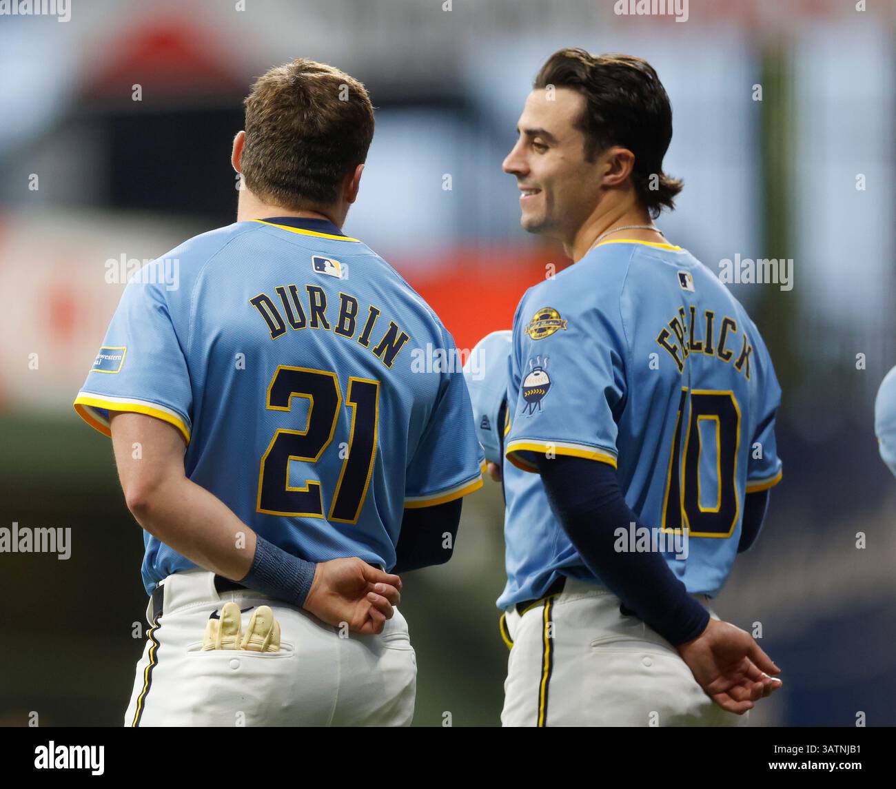Milwaukee Brewers' Caleb Durbin (21) talks to Sal Frelick before a ...