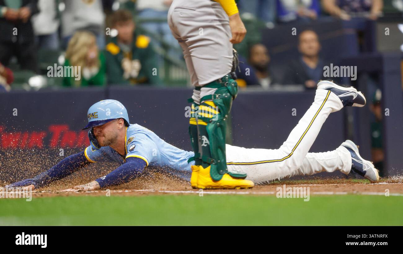 Milwaukee Brewers' Brice Turang scores on a double by teammate Jackson ...