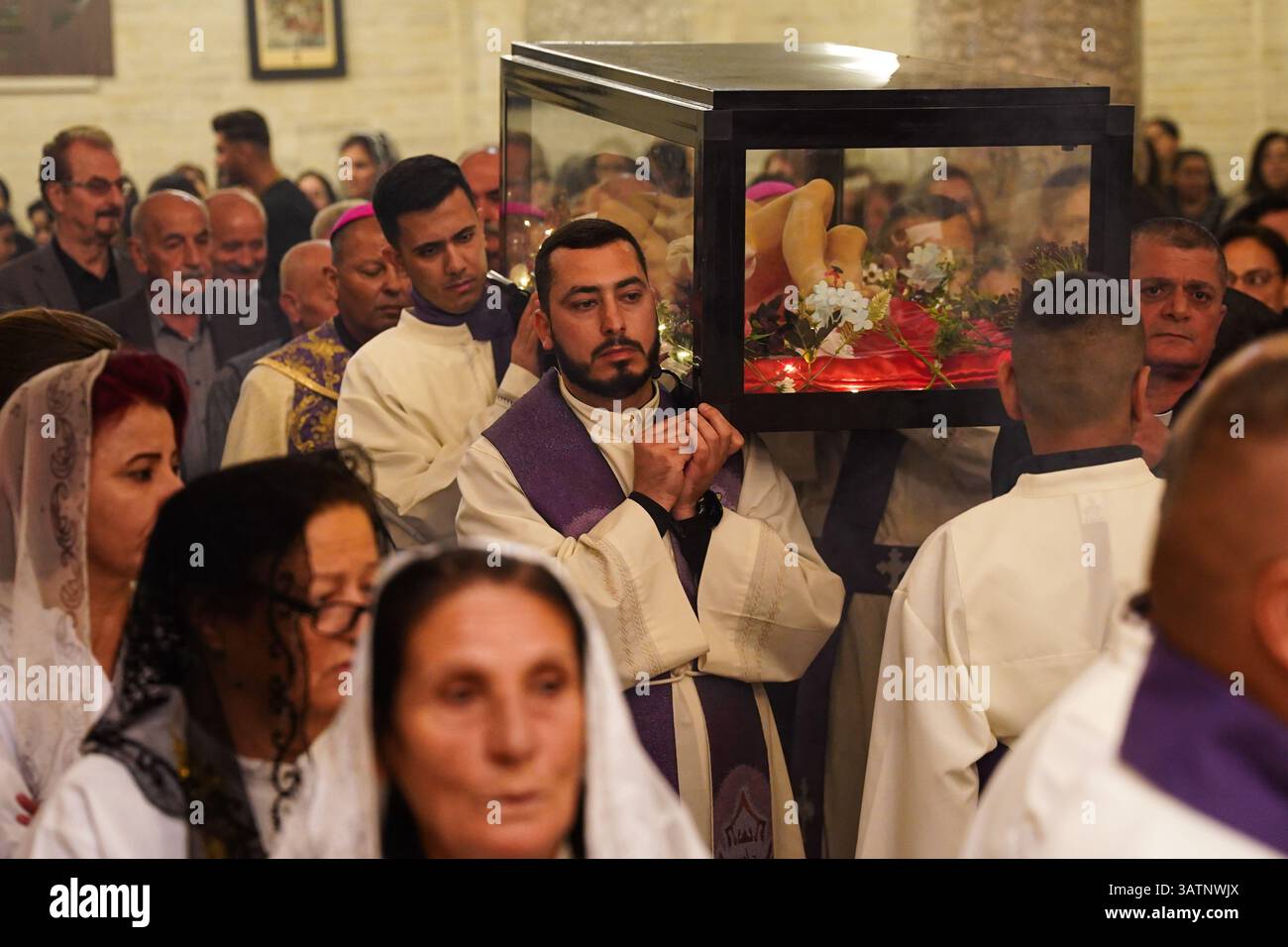 Alqosh, Iraq. 18th Apr, 2025. Clergy carrying the coffin of Christ ...