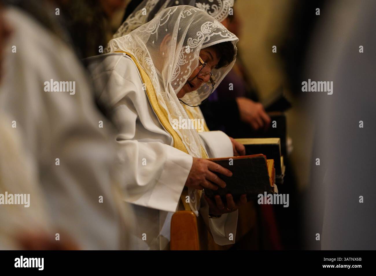 A Christian woman attends the Good Friday procession at Mar Gorgis ...