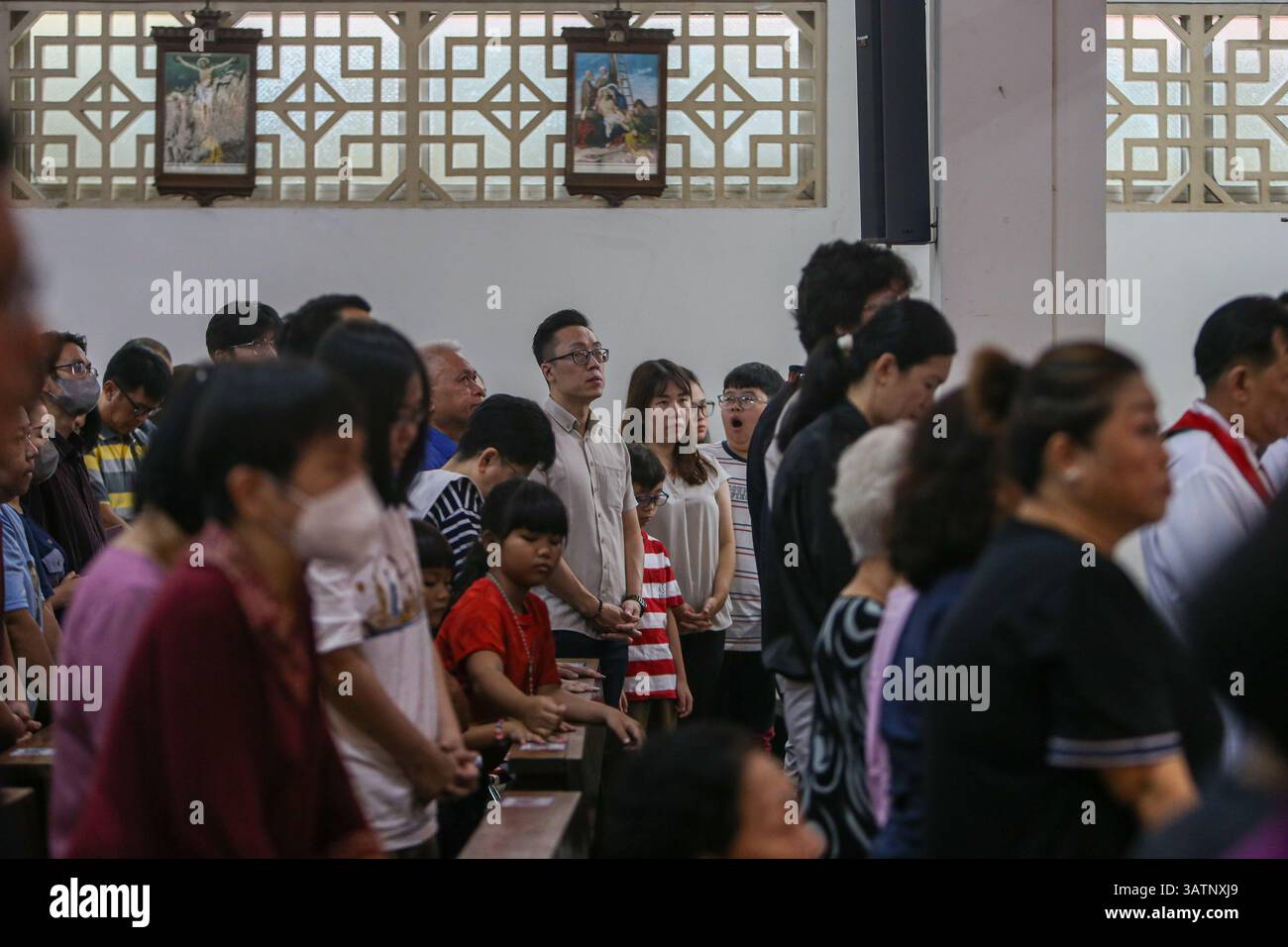 West Jakarta, Jakarta, Indonesia. 18th Apr, 2025. Catholics attend a ...