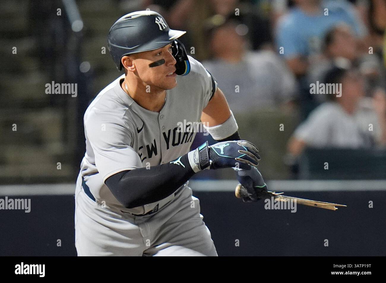 New York Yankees' Aaron Judge holds his broken bat as he lines out to ...