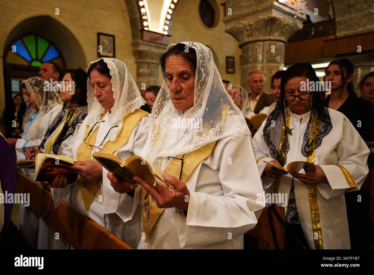 Christians attend the Good Friday procession at Mar Gorgis Chaldean ...