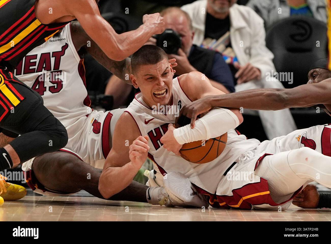 Miami Heat guard Tyler Herro (14) fights for the ball in overtime of an ...